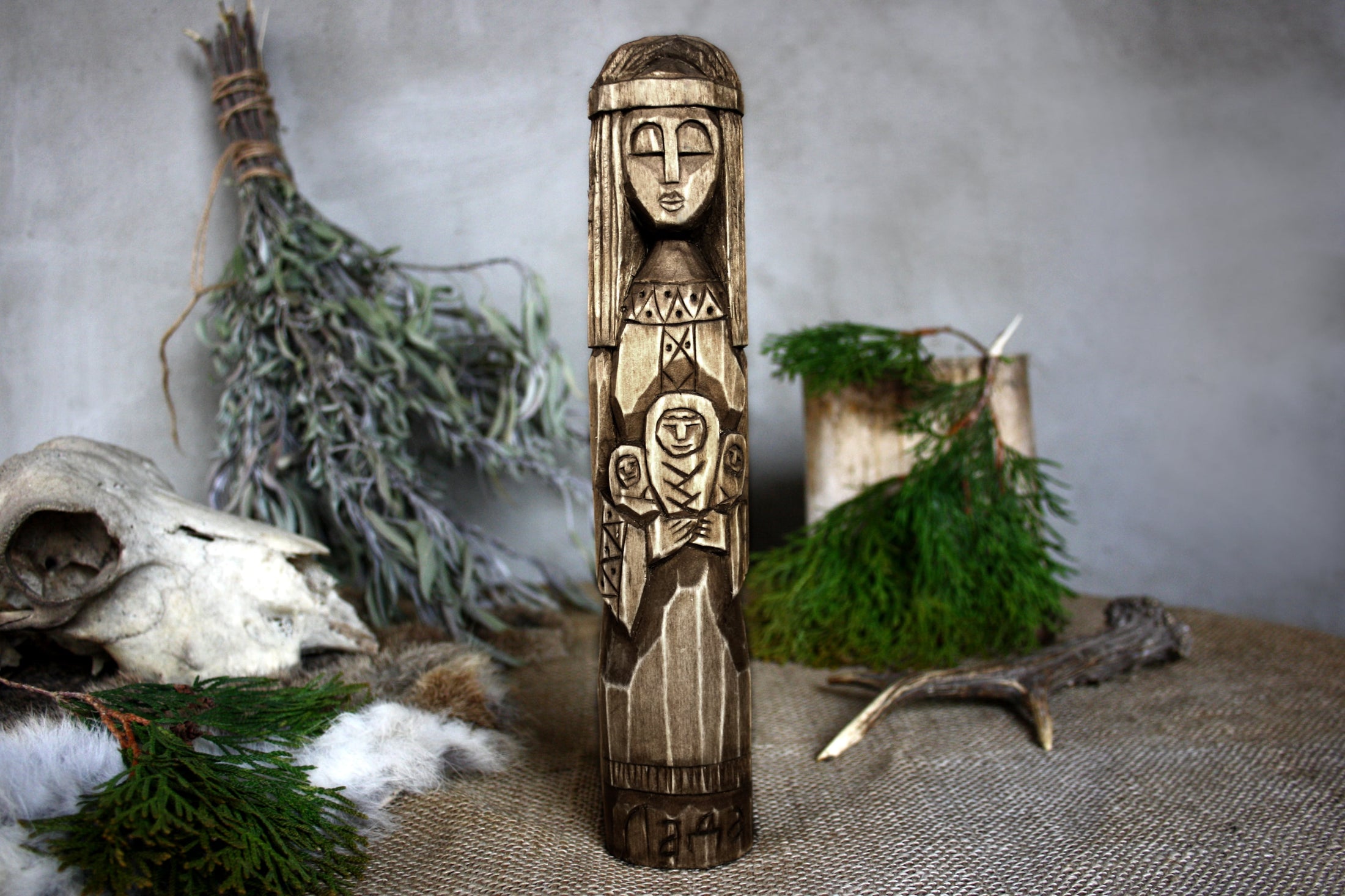 Wooden statue of Slavic Goddess LADA in dark